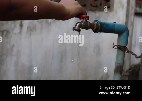 Young Hand Is Turning Off Slow Flowing Old Water Tap To Save Water Save Water Concept Stock