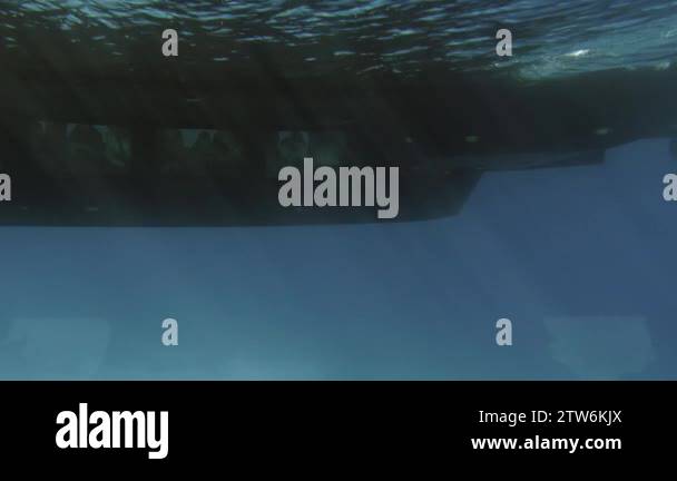 bottom of the ship under water. The motors turn on and the propeller ...