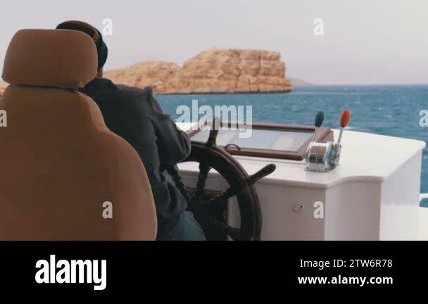 Captain Controls the Tourist Yacht in Sea Storm. Steering Wheel of a ...