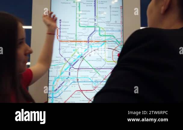 Women exploring subway interactive map Stock Video Footage - Alamy