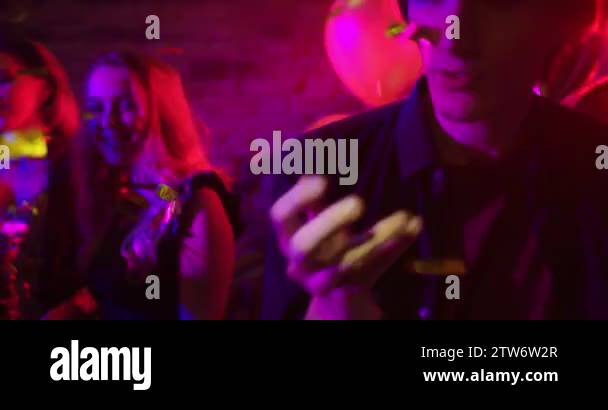 Nightclub Party with Confetti/People dancing in a nightclub. Confetti ...