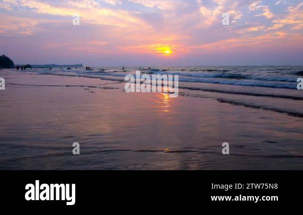 The evening walk along the beach in Chaung Tha resort with a view on ...