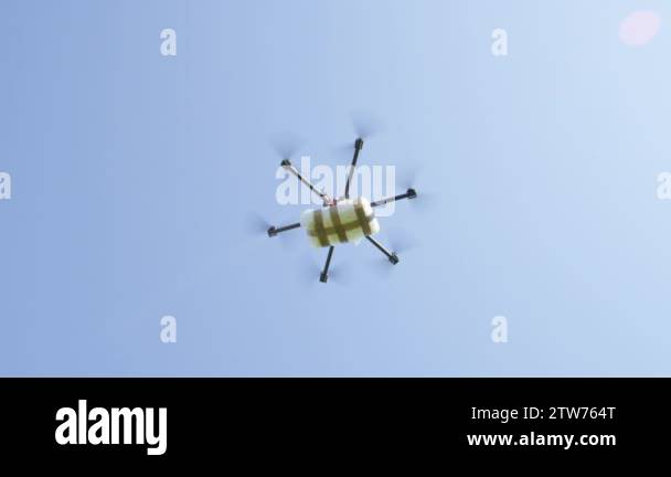 CLOSE UP: Drone delivery of illegal drugs. UAV aircraft flying drug ...