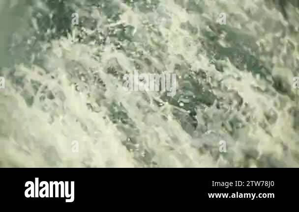 engine propellers churn the water in waves and wakes. The spray of ...