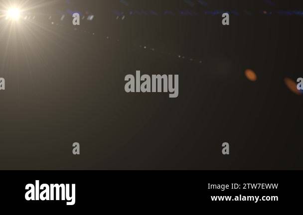 Rotating flickering lens flare effect on black background. 4k animation ...