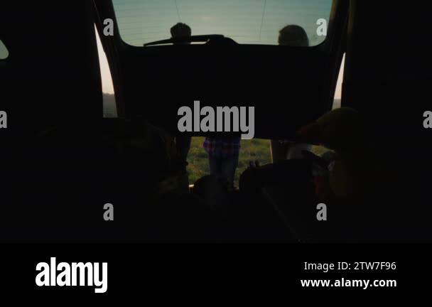 The family with the child came to rest, get things out of the trunk of ...