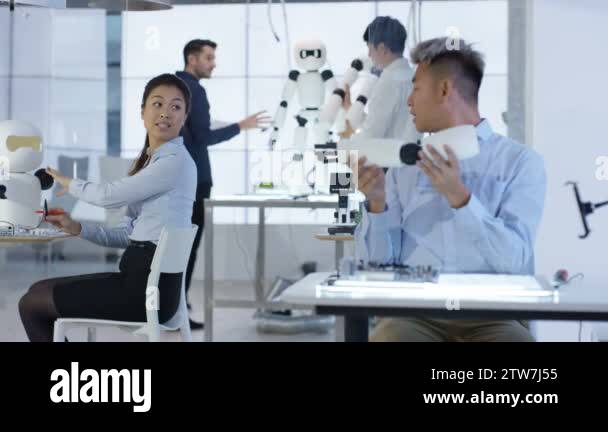 4K Technical design team working on construction of robot in modern lab ...