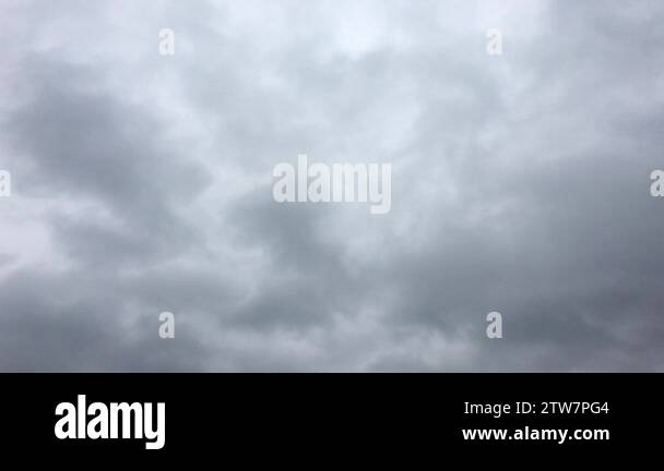 White clouds disappear in the hot sun on blue sky. Time-lapse motion clouds blue sky background ...
