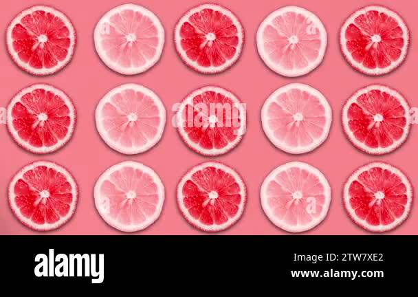 Abstract red color animation of sliced lemon and grapefruit on pastel ...