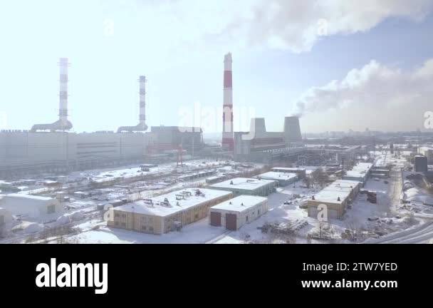 Industrial area and smoking chimney on power plant in city aerial ...
