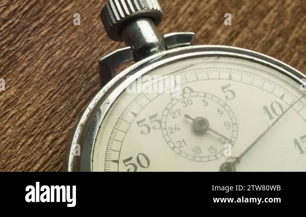 Vintage White Stopwatch on the Brown Structural Background Rotates the ...