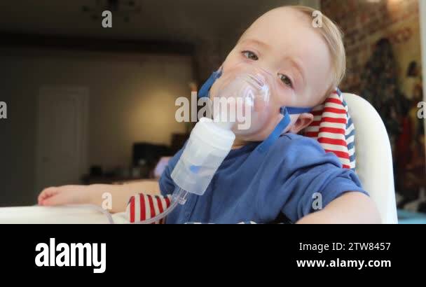 Inhalation child 1,5 year nebulizer mask vapor Stock Video Footage - Alamy