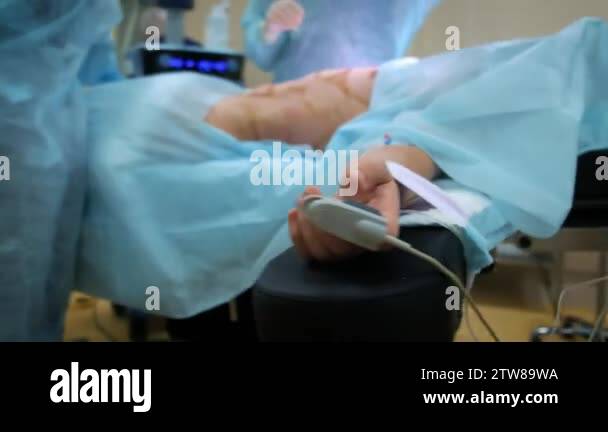 Patients Hand in Bed with Oximeter. Resuscitate the patient, measure ...