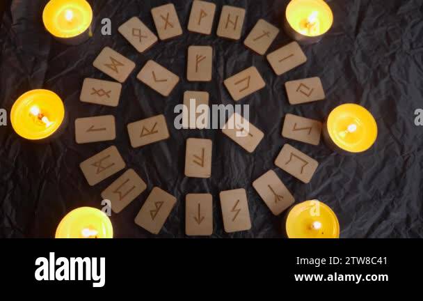 Wooden rune wheel. runic layout and candles, 4k, slow-motion shooting ...