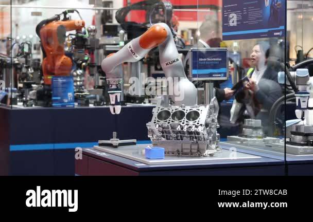Kuka robot arm with Schunk mechatronic gripper on Messe fair in ...