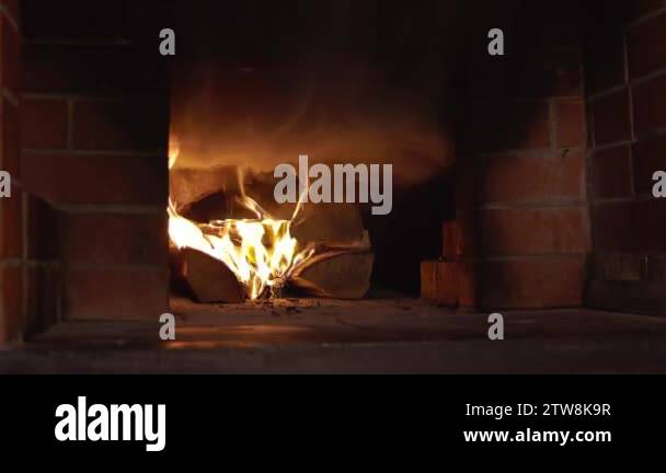 Swirling smoke layers coming out of the furnace of the Russian stove ...