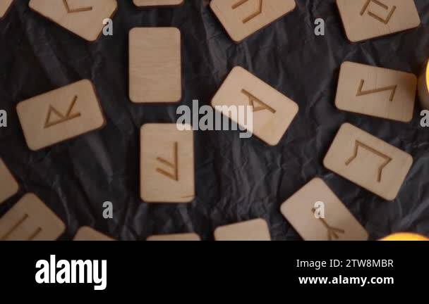 Wooden rune wheel. runic layout and candles, 4k, slow-motion shooting ...