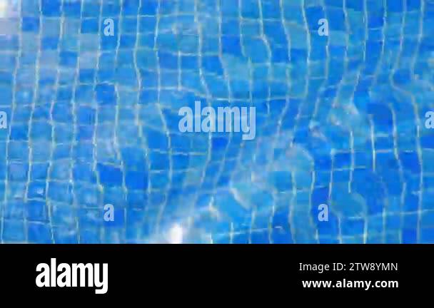 water ripples in swimming pool, blue tile background, loop-ready Stock ...
