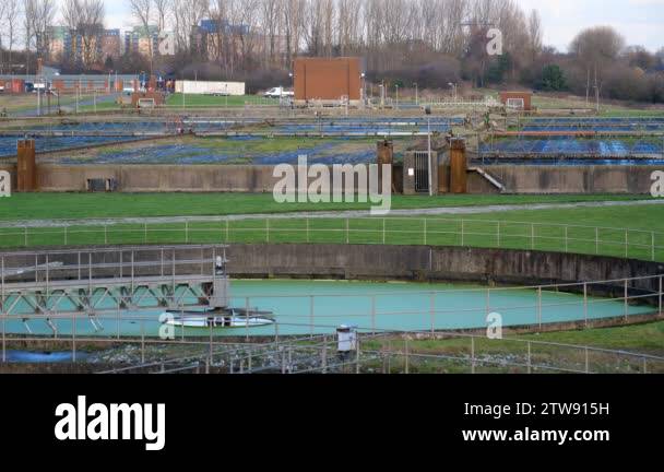 Round sedimentation tank in front of sewage filtration bed with a huge ...