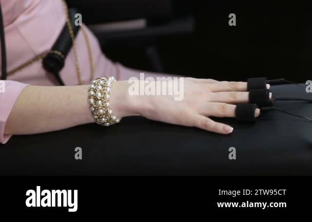 Lie-detector test, a woman answers the questions of the expert A woman ...