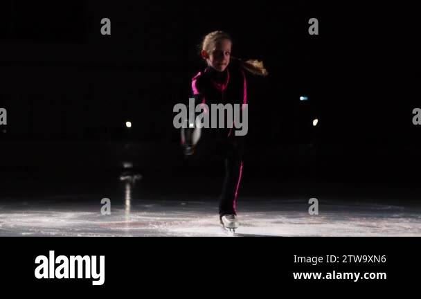 A professional little figure skater at the figure skating competitions ...