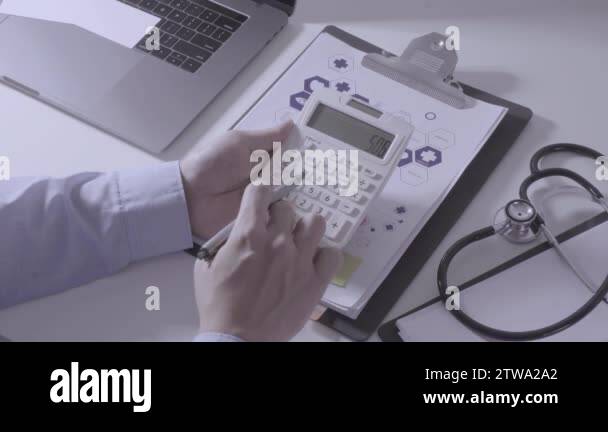 Above view of Healthcare costs and fees concept.Hand of smart doctor ...