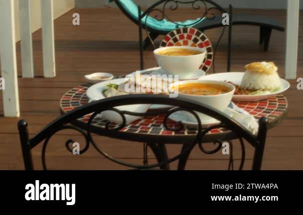 dishes of Thai cuisine. 4k. table by the pool. Thai traditional lunch ...