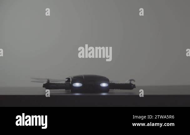 Futuristic transportation concept.Micro drone take off from laptop ...