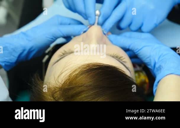 Dental clinic concept. TMJ examining in modern dentists office. Woman ...