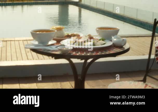 dishes of Thai cuisine. 4k. table by the pool. Thai traditional lunch ...