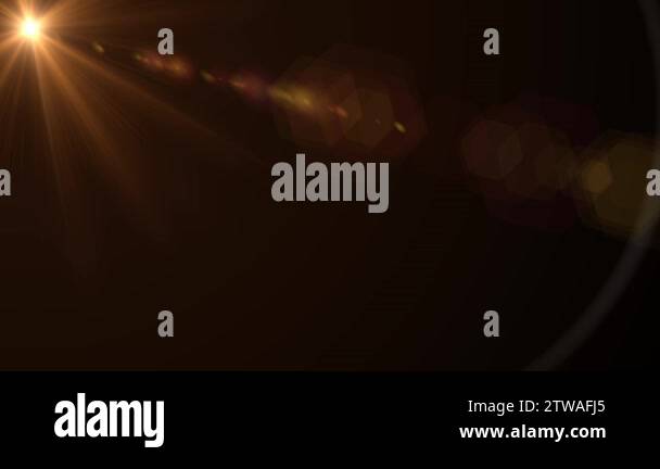 Rotating flickering lens flare effect on black background. 4k animation ...