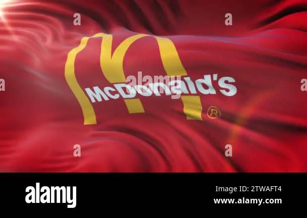 MCDONALDS flag waving on sun. Seamless loop with highly detailed fabric ...