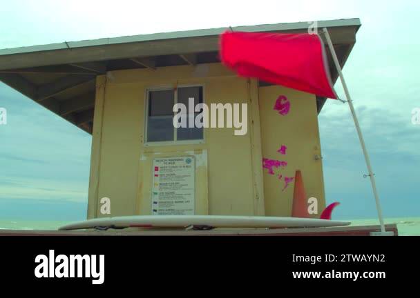 Beach red warning hazard flag on the beach during a storm lifeguard ...