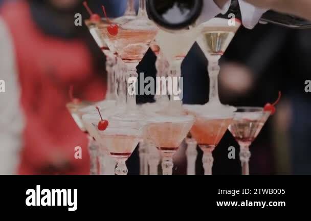 Pyramid of champagne glasses with liqueur Stock Video Footage - Alamy