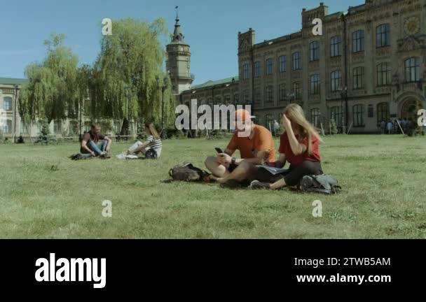 Students studying on lawn on campus Stock Videos & Footage - HD and 4K ...