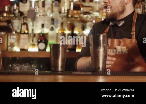 close shot bar counter where the bartender is engaged in the ...