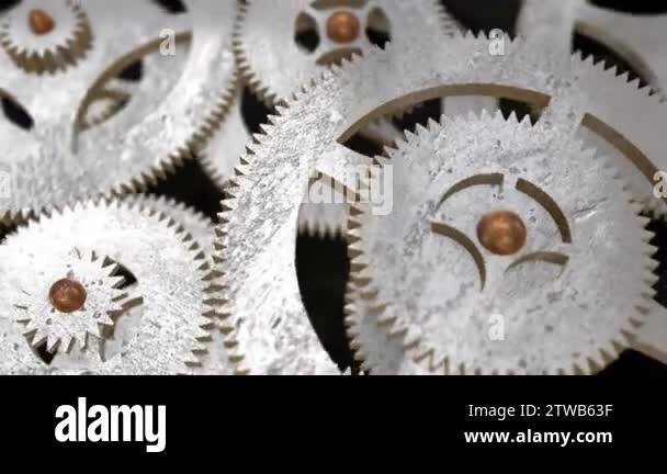 the camera moves along the rotating gears and focuses on the ...
