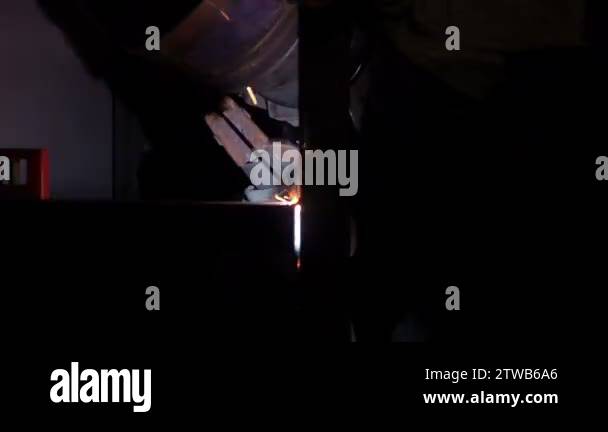 Welder Worker Performs Jump Welding. Worker Welder Performs Arc-Welding ...
