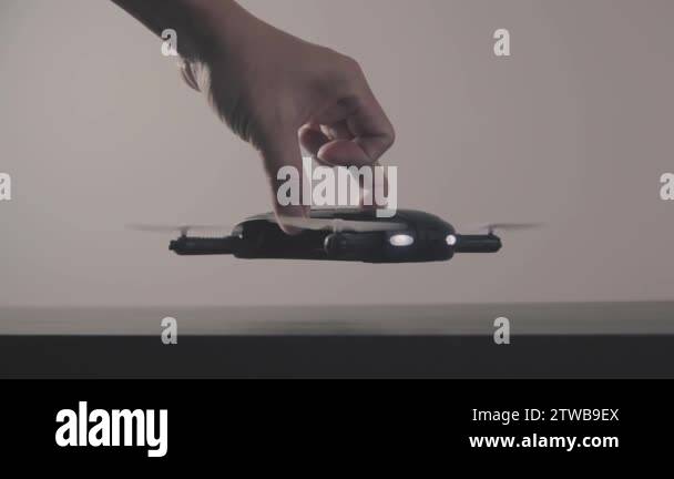 Futuristic transportation concept.Micro drone take off from laptop ...
