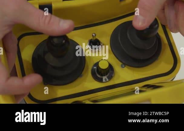 Engineer hands using industrial wireless remote control panel for ...