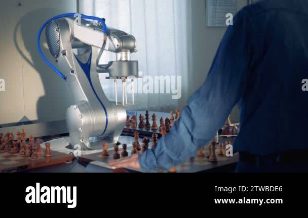 Robot hand, robotic arm playing chess witha man. Futuristic concept ...