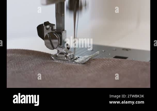 Slow motion of needle with thread of sewing machine sew fabric for ...