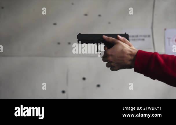 Gun is shot close-up. Pistol in hand close-up. Pistol being shot 1 ...