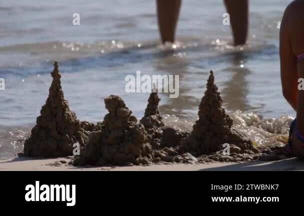 Water washing away sand castle Stock Videos & Footage - HD and 4K Video ...