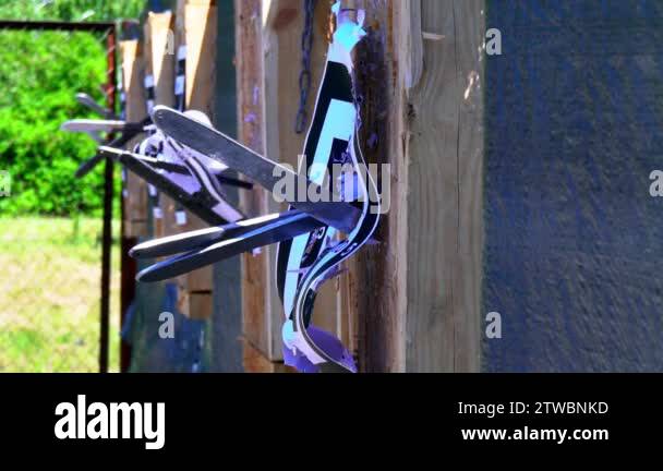 Throwing knives at the target from an open-air distance, a competition ...