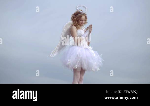 Happy teenage angel girl pray. Child with angelic character. Girl ...