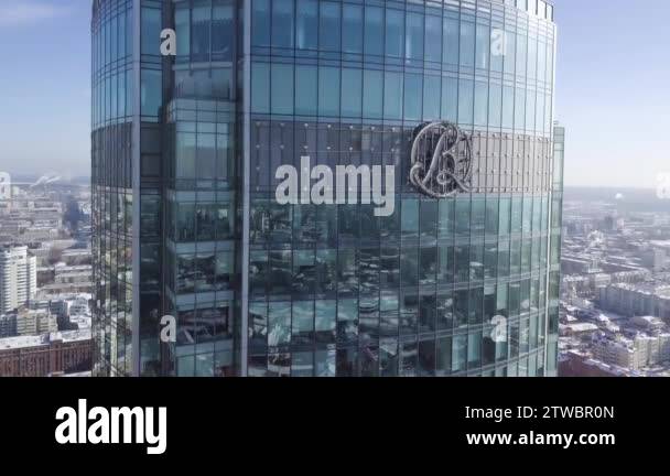 Close up of windows of modern skyscraper. Clouds refelected in modern ...