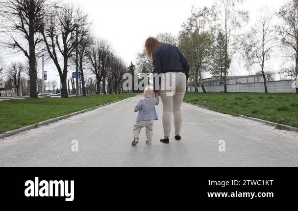 Mom teaching toddler to walk Stock Videos & Footage - HD and 4K Video ...