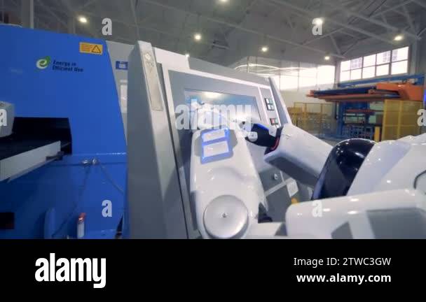 Robot set up industrial factory equipment using touchscreen. 4K Stock ...