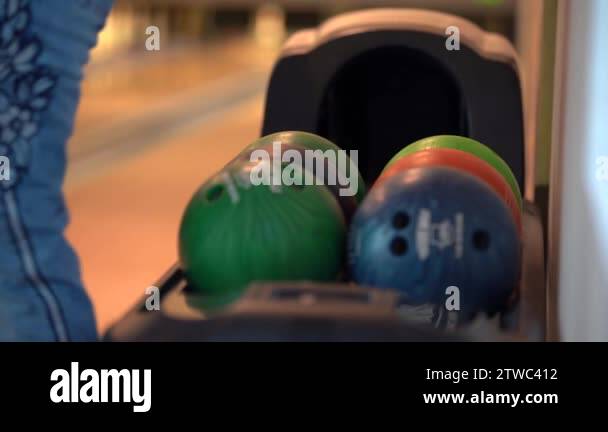 In the frame of the Ball return system with colorful bowling balls ...